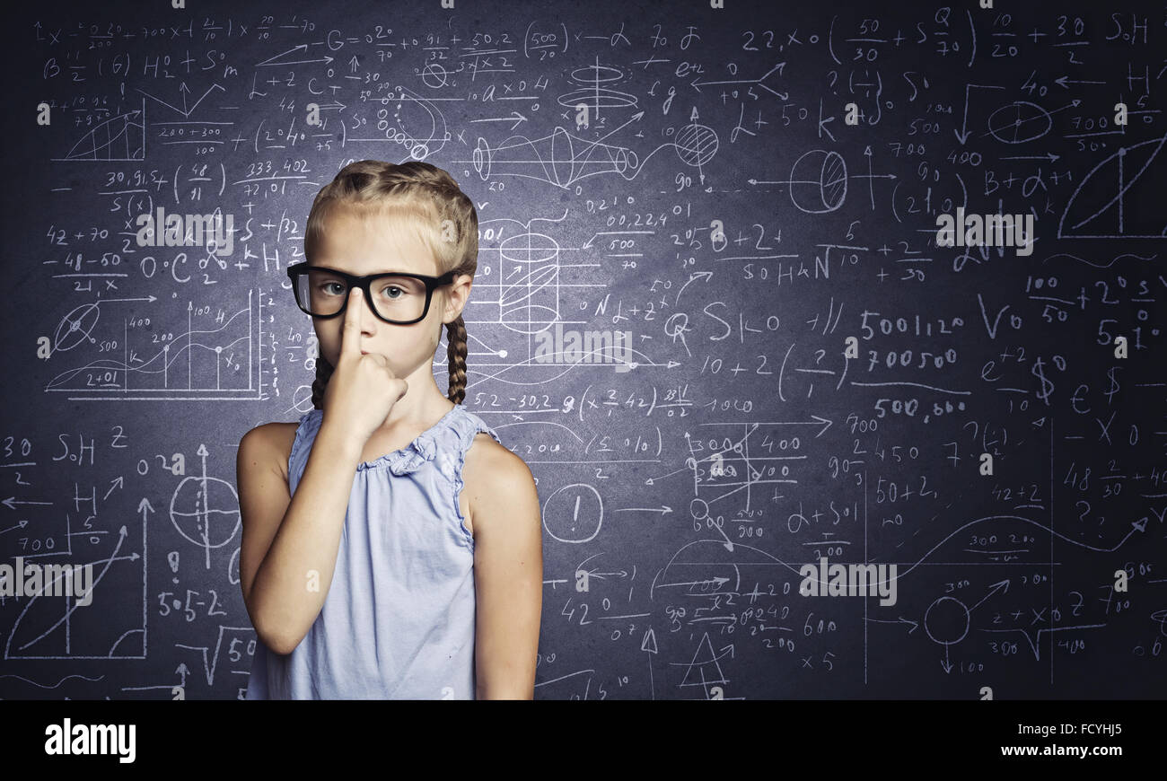 Genius girl in red glasses near blackboard with formulas Stock Photo ...