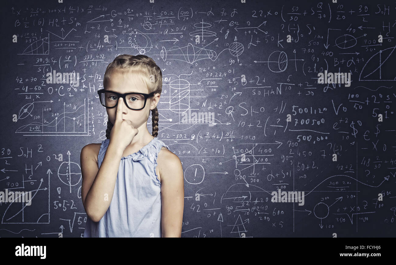 Genius girl in red glasses near blackboard with formulas Stock Photo ...