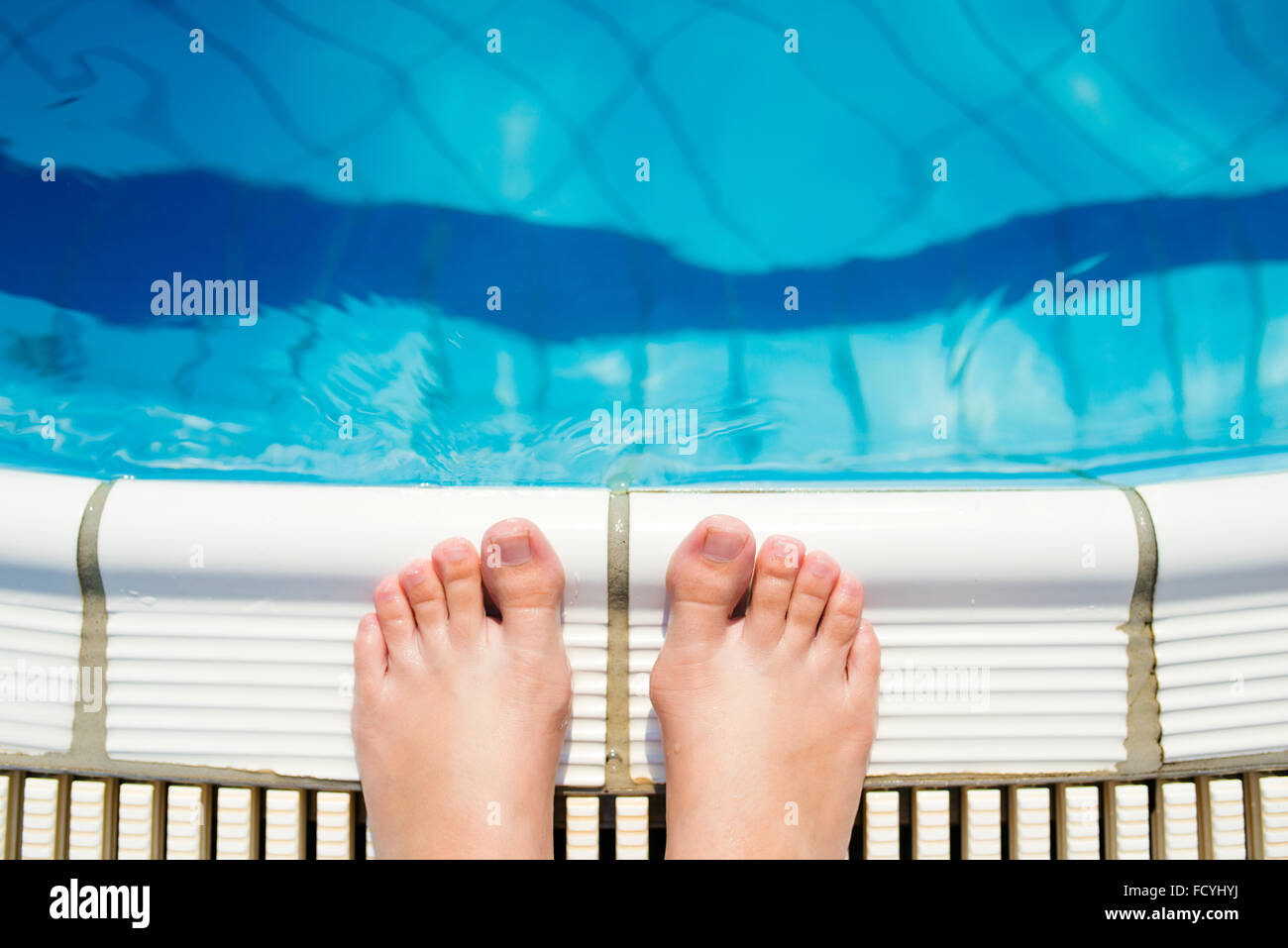 Feet at the swimming pool Stock Photo - Alamy
