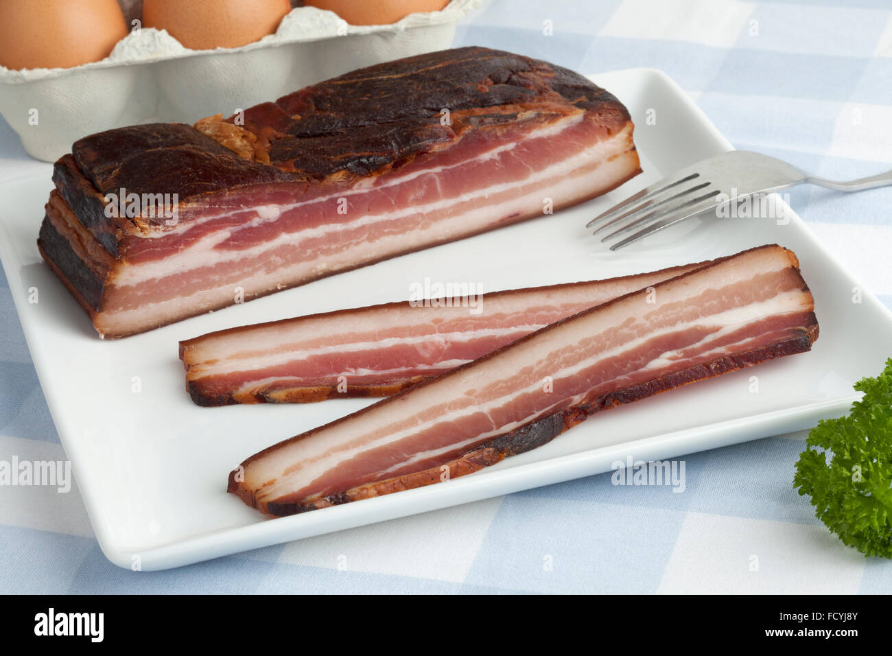 German Schwarzwalder seitenspeck and slices with eggs Stock Photo - Alamy