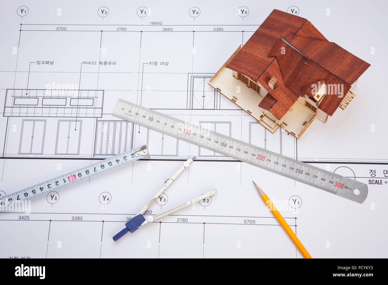High angle of objects related to design for blueprint with a miniature ...