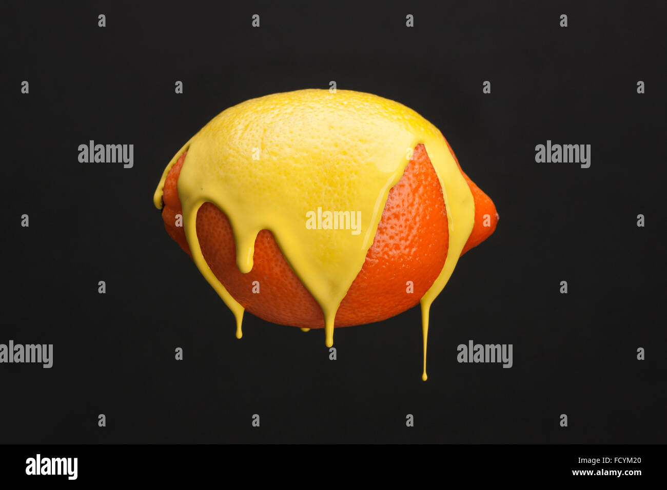 Orange color yellow with yellow paint dripping down Stock Photo - Alamy