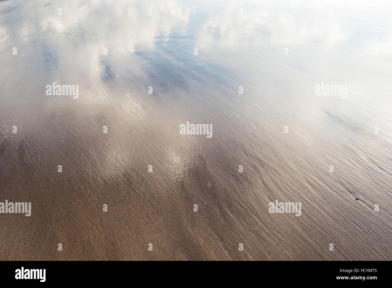 Wet sand beach cloud reflection coastline abstract Stock Photo - Alamy