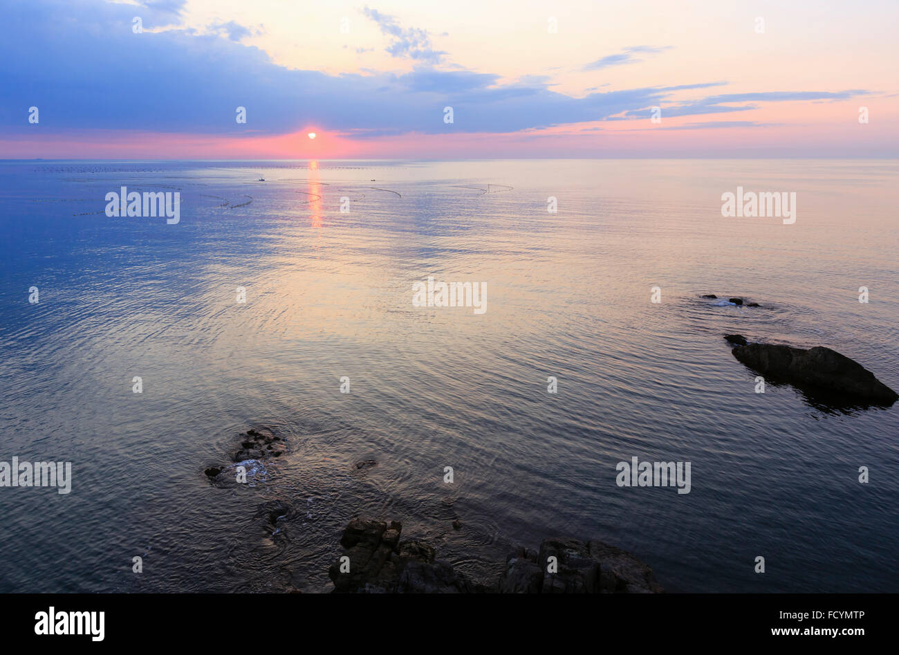 Beautiful fascinate morning sea view with sunrise, sun track on surface ...