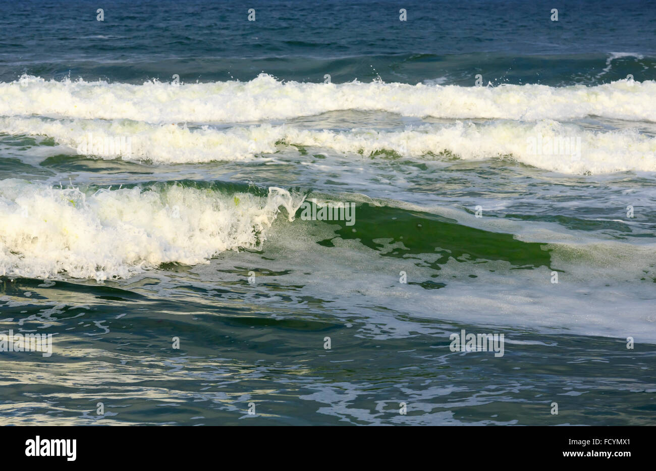 Sea surf with splashes view from beach. Background Stock Photo - Alamy