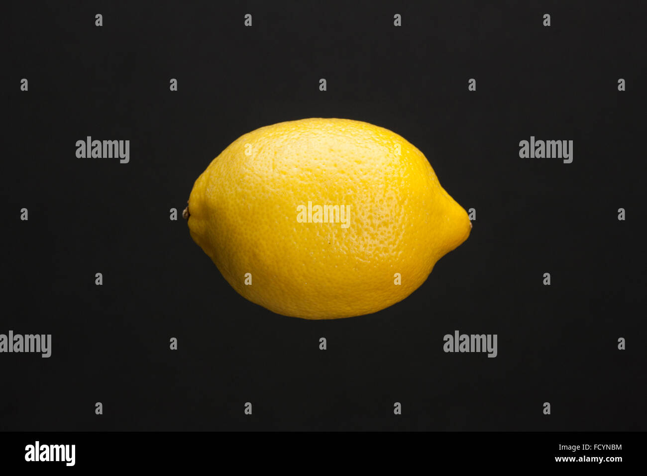 One yellow lemon Stock Photo - Alamy