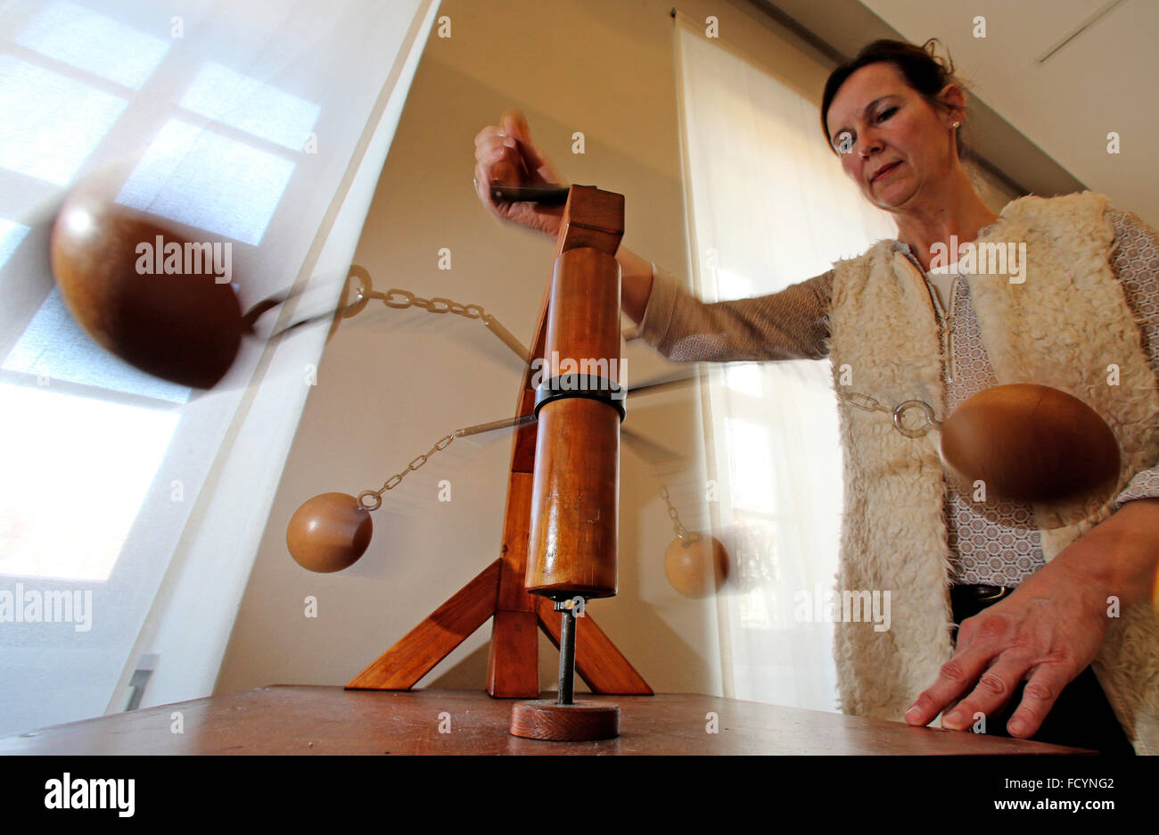 Exhibition employee Lisa Hufen operates a flywheel with sphere-shaped ...