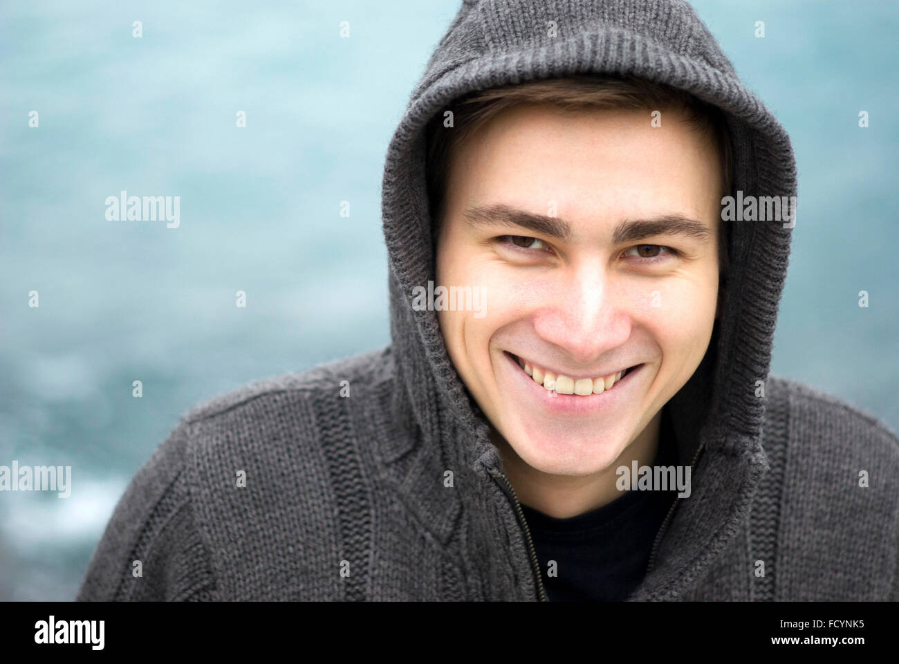 Young man smiling outdoors, portrait Stock Photo - Alamy