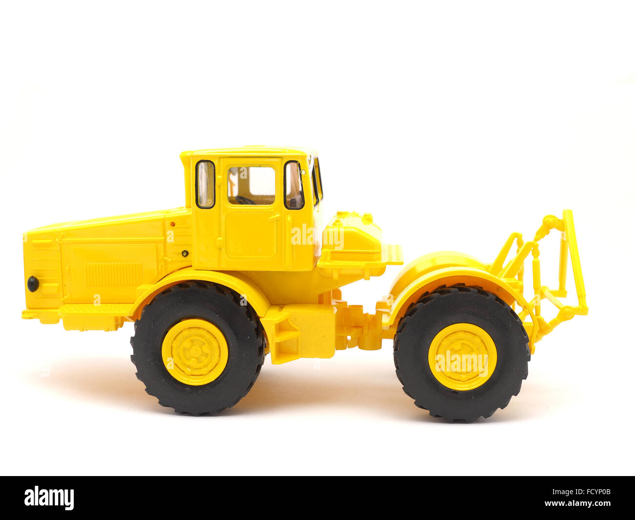 toy grader on a white background Stock Photo - Alamy