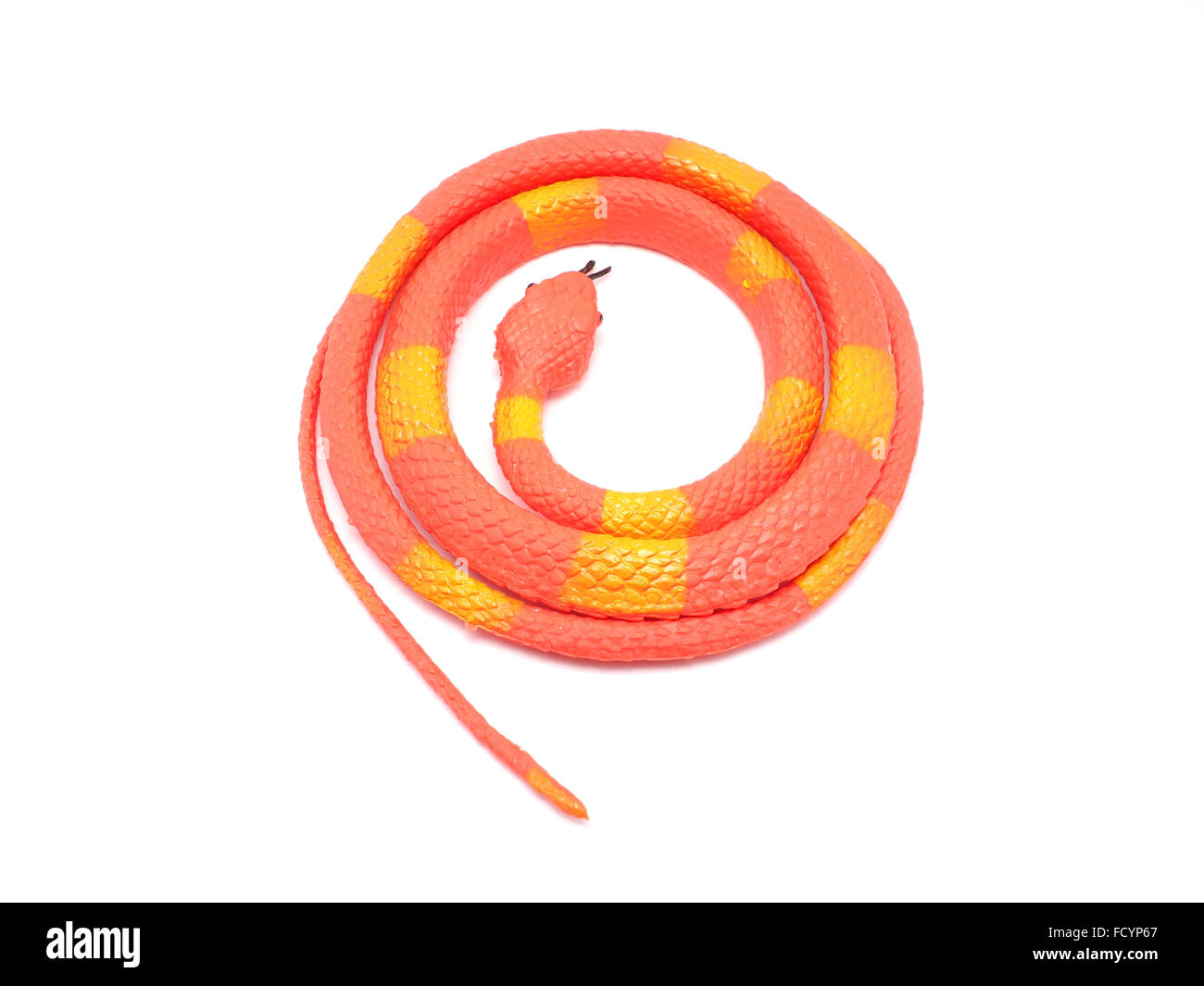 orange toy snake on a white background Stock Photo - Alamy