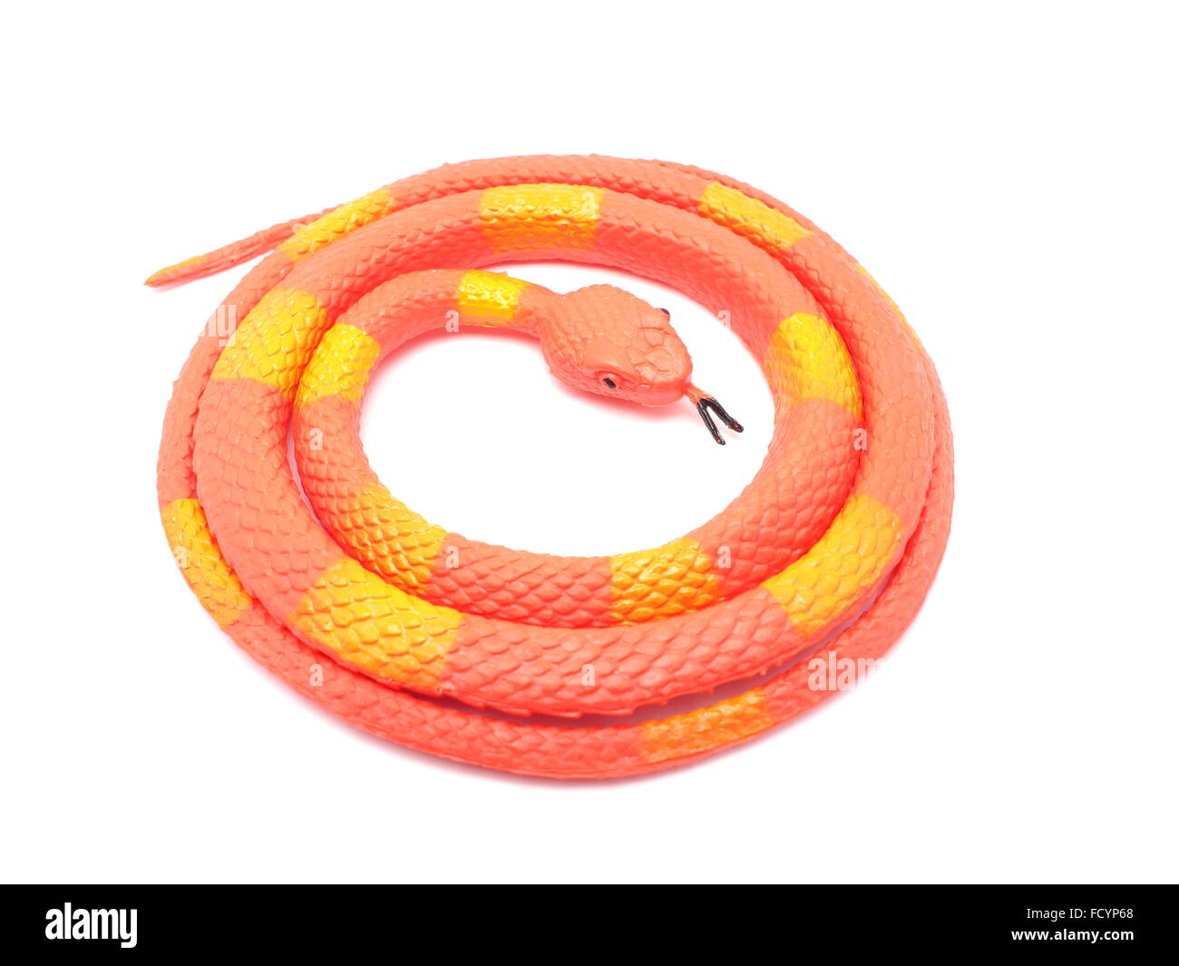 orange toy snake on a white background Stock Photo - Alamy