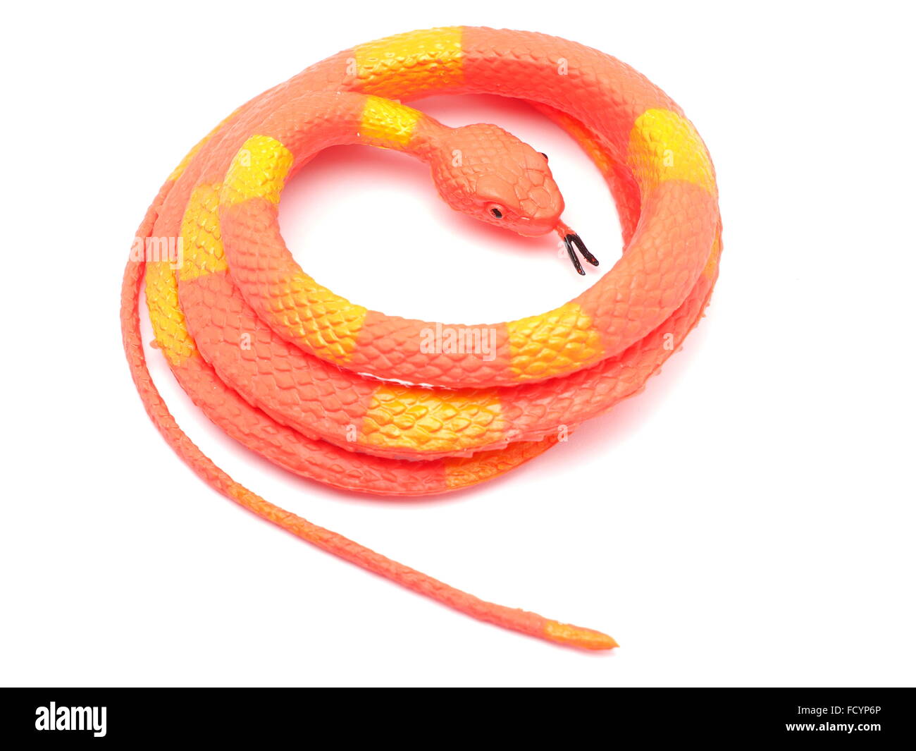 orange toy snake on a white background Stock Photo - Alamy