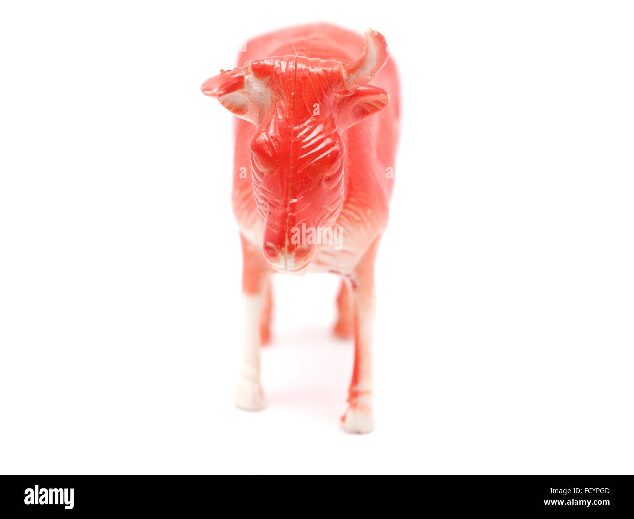 Red Bull toy on a white background Stock Photo - Alamy