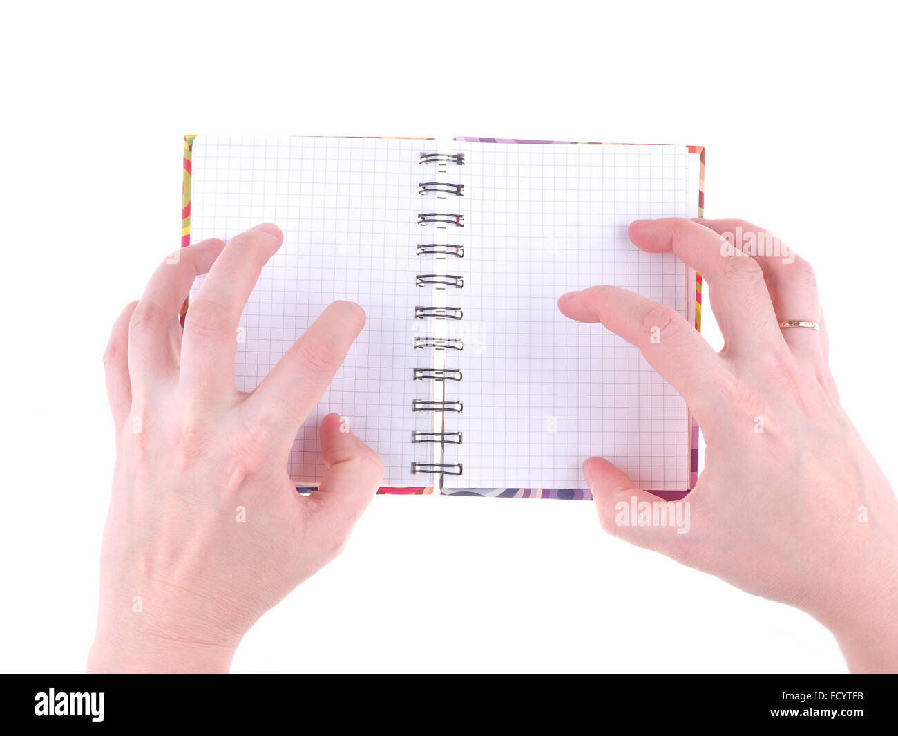 Hands reach for a notebook on a white background Stock Photo - Alamy