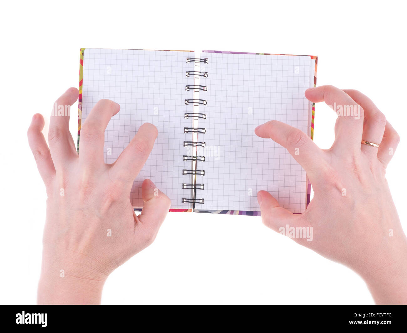 Hands reach for a notebook on a white background Stock Photo - Alamy