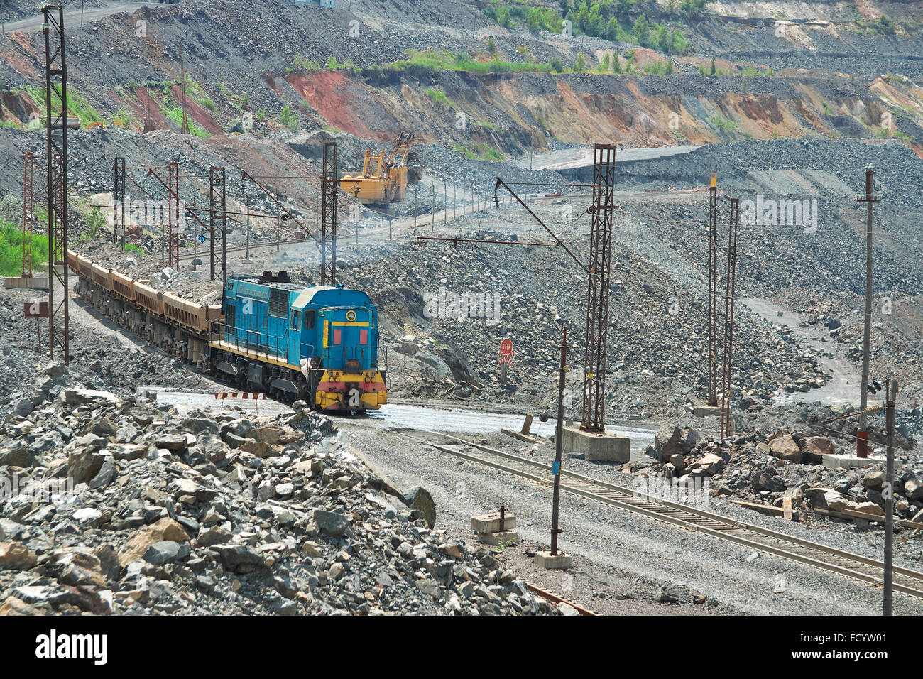 Cargo train with iron ore on the opencast mining site Stock Photo - Alamy