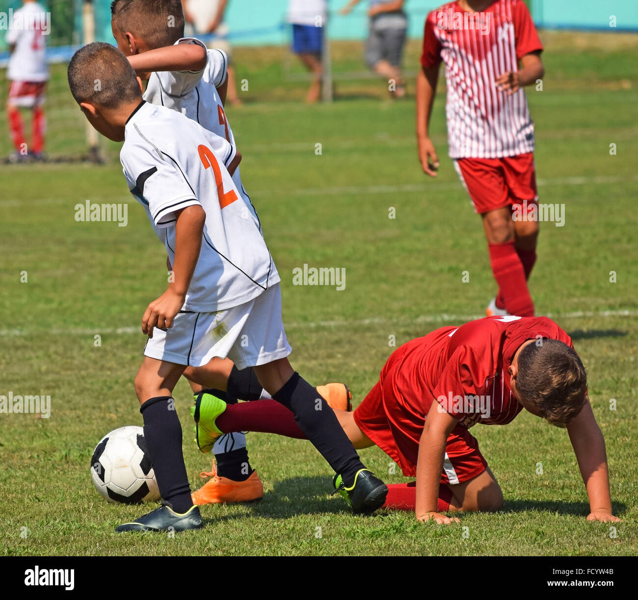 Children shooting soccer ball hi-res stock photography and images - Alamy