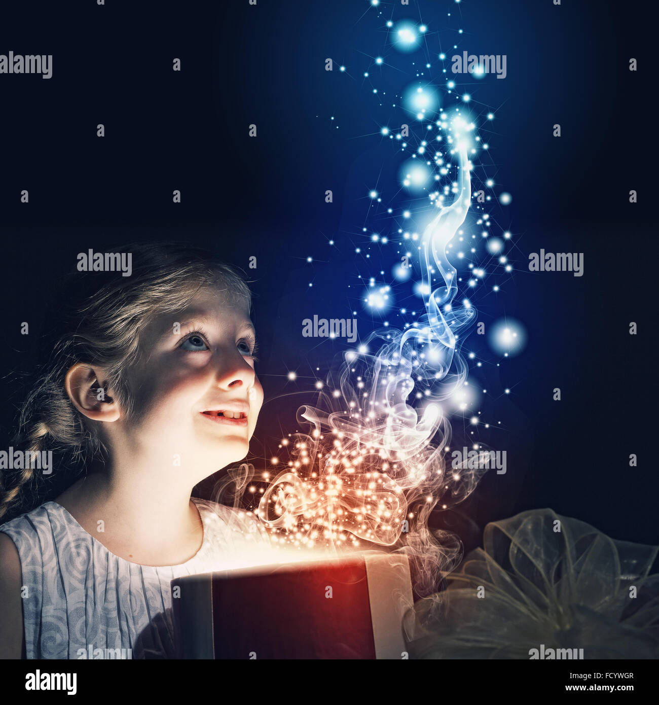 Little cute girl opening Christmas gift box Stock Photo - Alamy