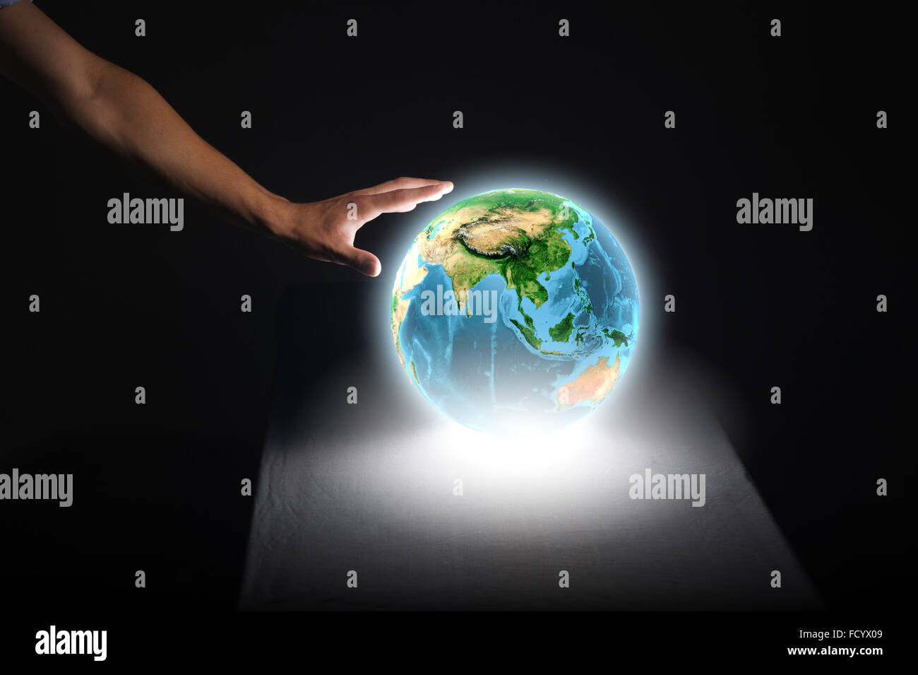 Close up of human hand touching Earth planet. Elements of this image ...