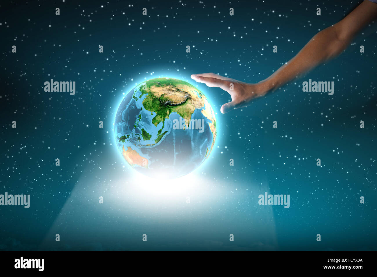 Close up of human hand touching Earth planet. Elements of this image ...