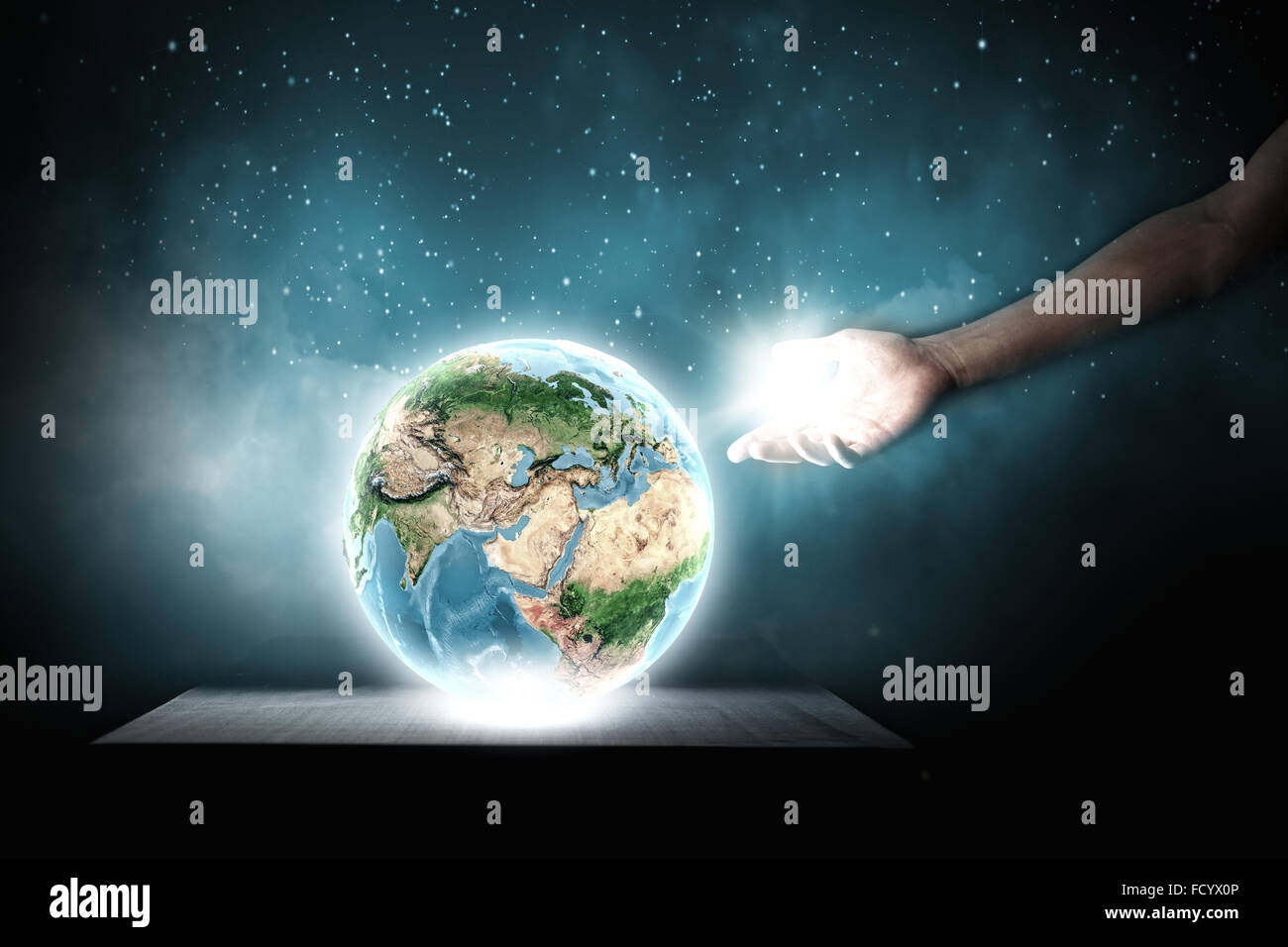 Close up of human hand touching Earth planet with finger. Elements of ...