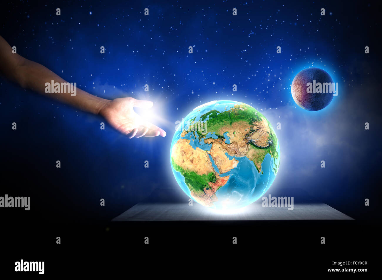 Close up of human hand touching Earth planet with finger. Elements of ...