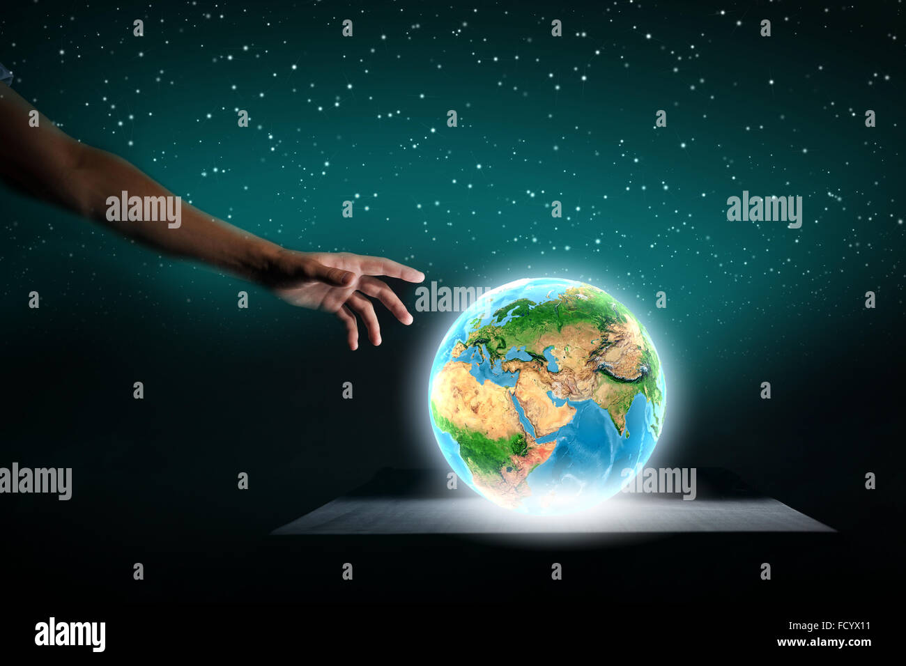 Close up of human hand touching Earth planet with finger. Elements of ...