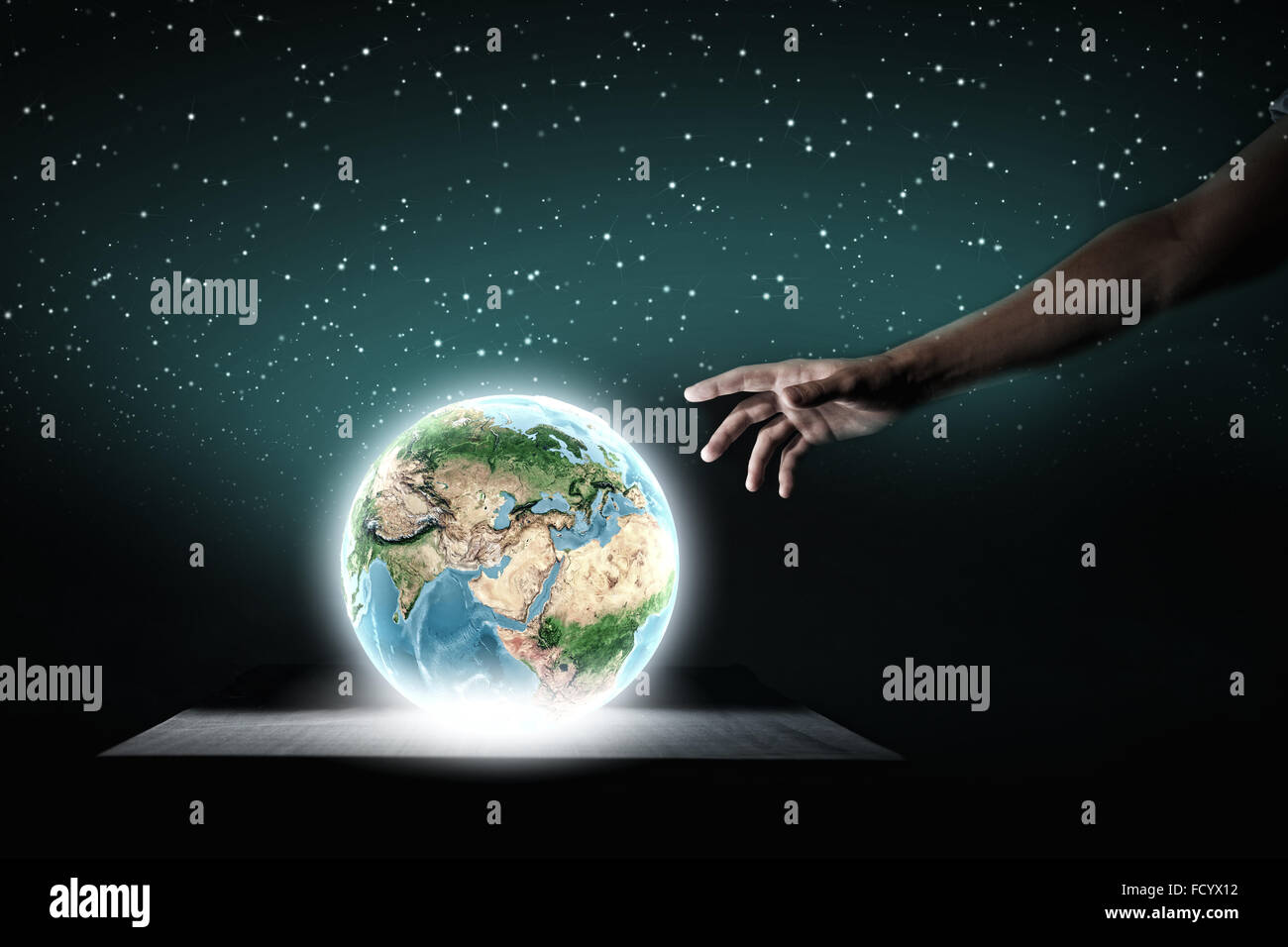 Close up of human hand touching Earth planet with finger. Elements of ...