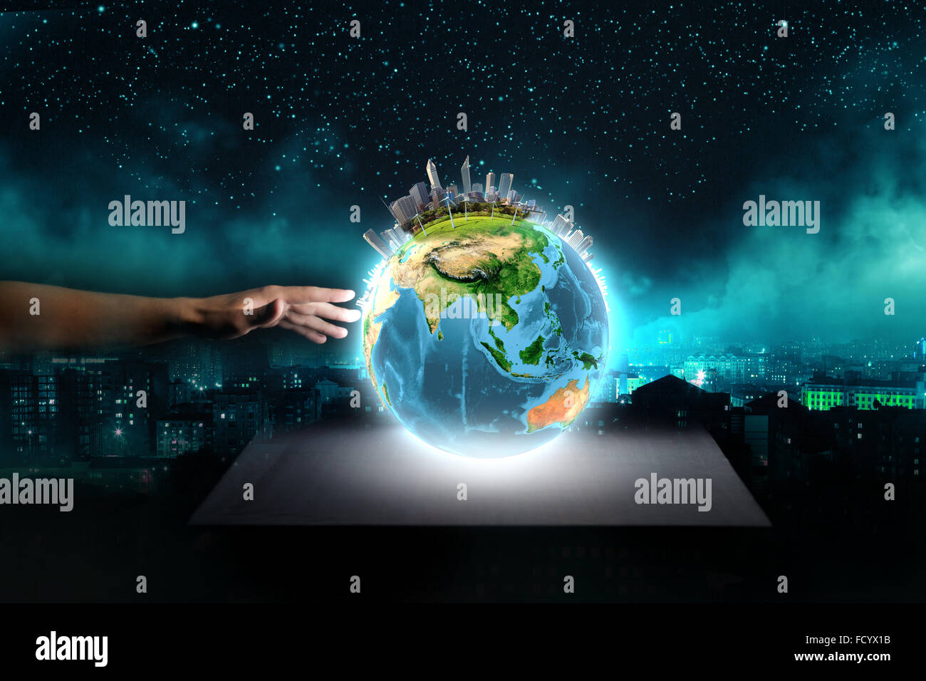 Close up of human hand touching Earth planet with finger. Elements of ...