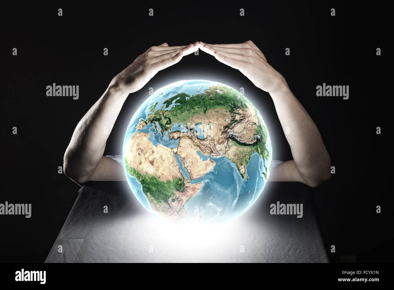Close up of human hands protecting Earth planet. Elements of this image ...