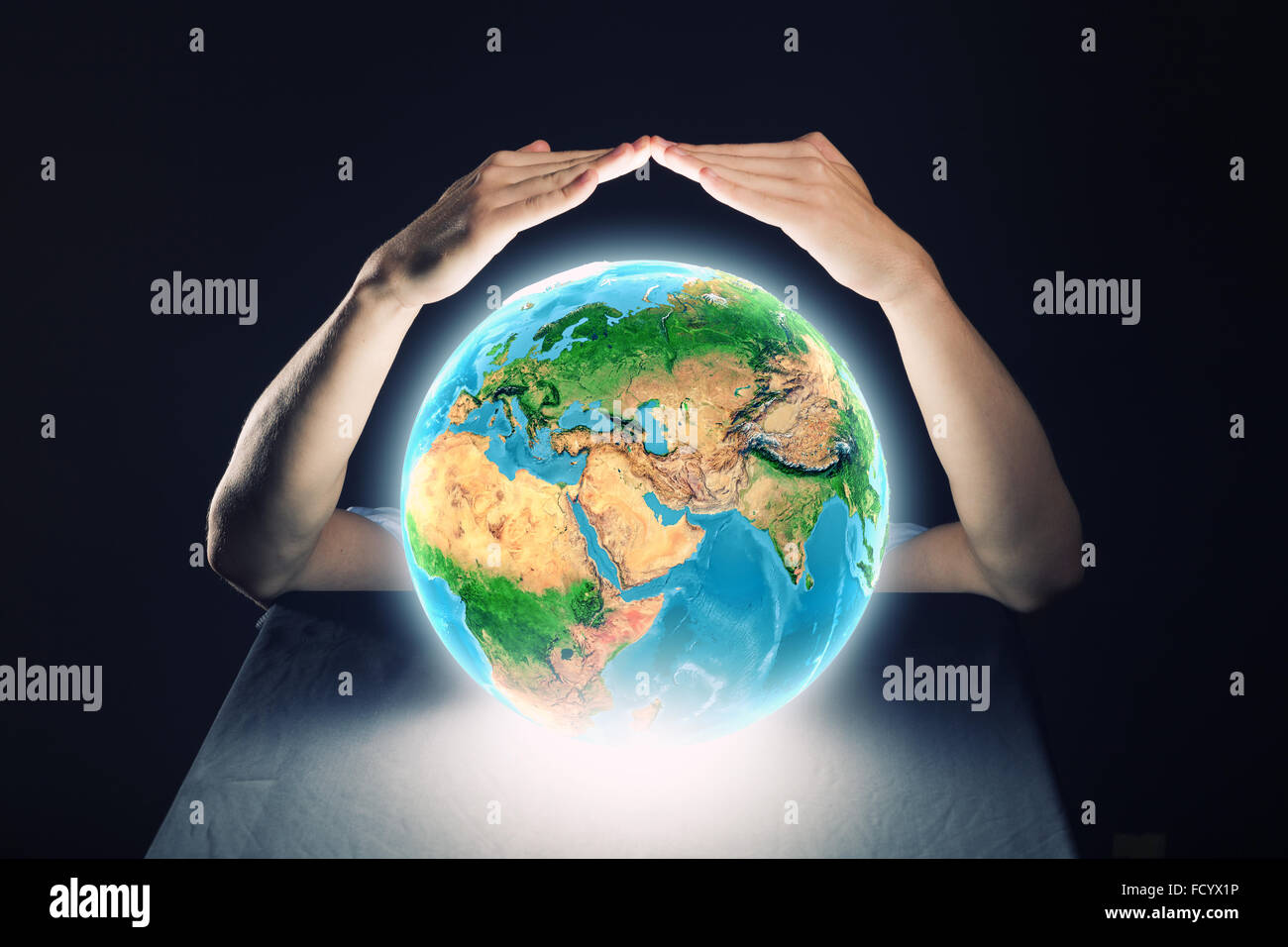 Close up of human hands protecting Earth planet. Elements of this image ...