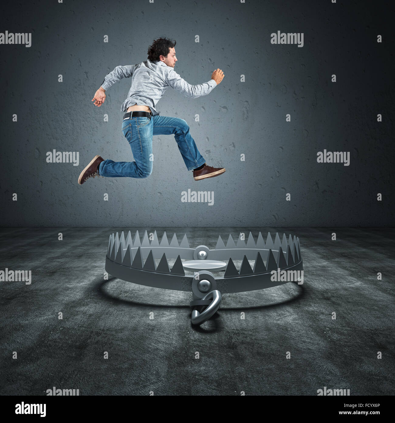 worker jump over bear trap Stock Photo - Alamy
