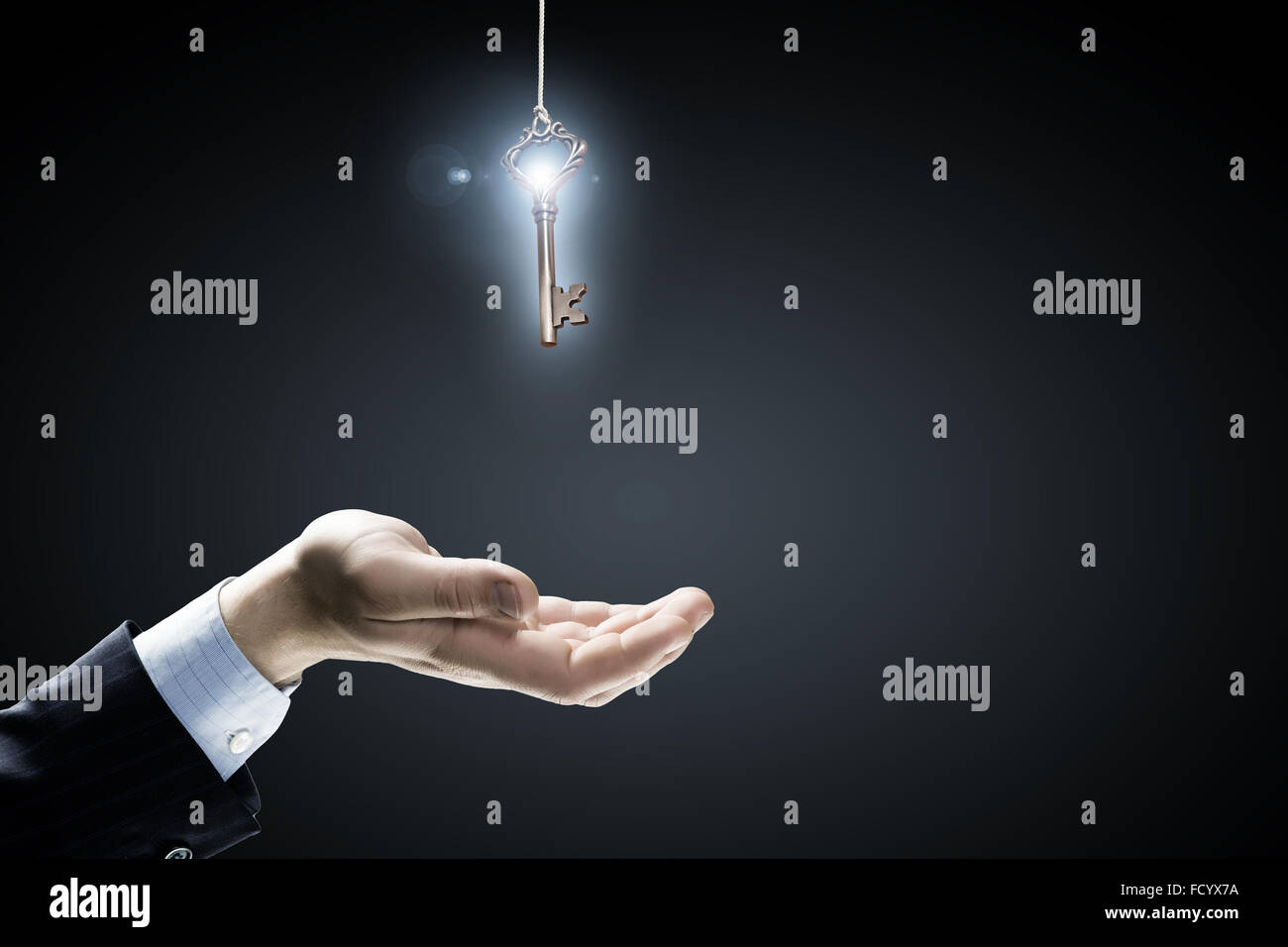 Close up of human hand holding key Stock Photo - Alamy