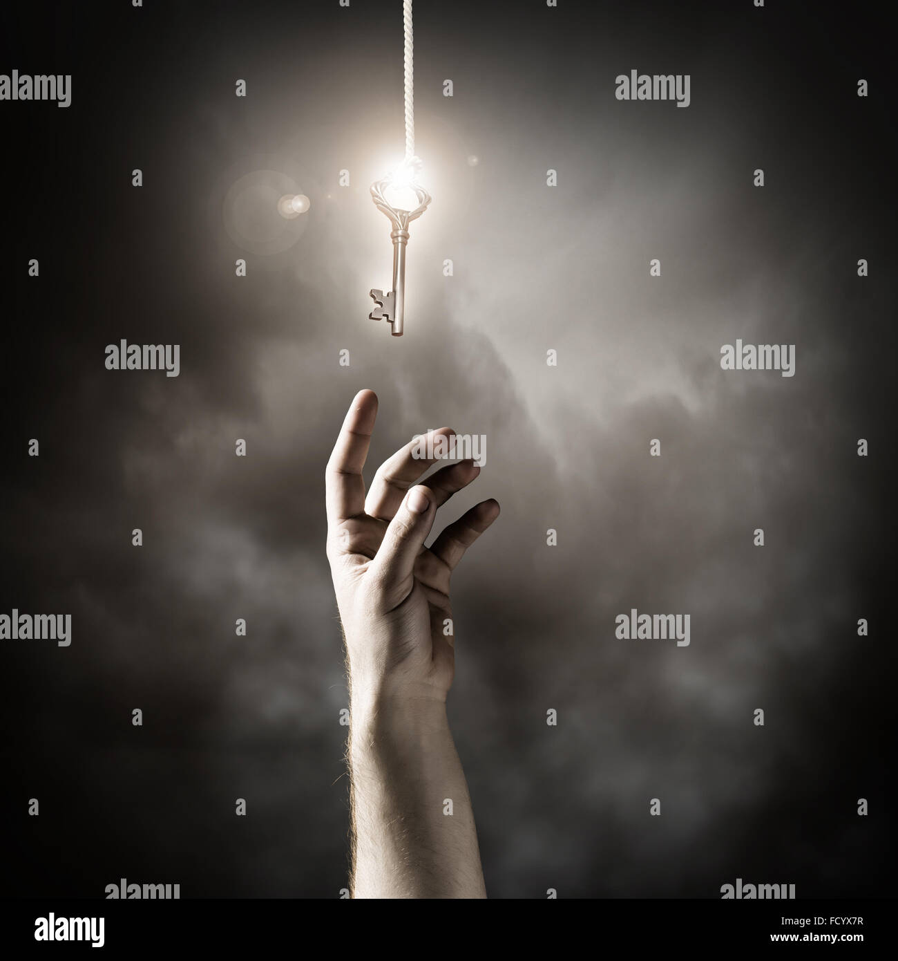 Close up of human hand holding key Stock Photo - Alamy