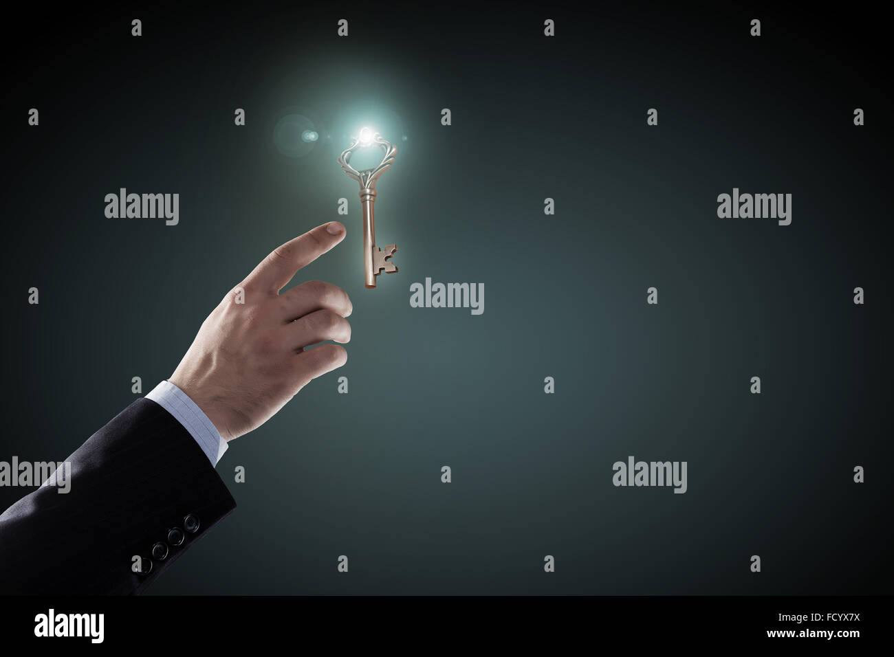 Close up of human hand holding key Stock Photo - Alamy