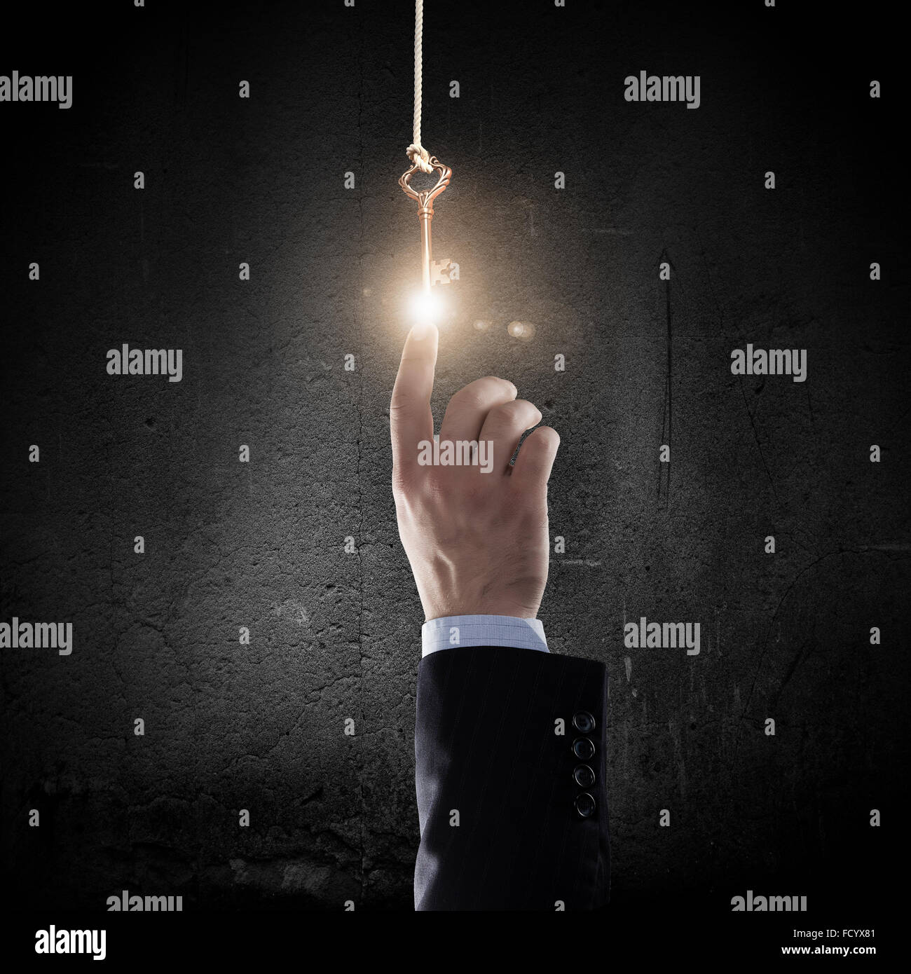 Close up of human hand holding key Stock Photo - Alamy