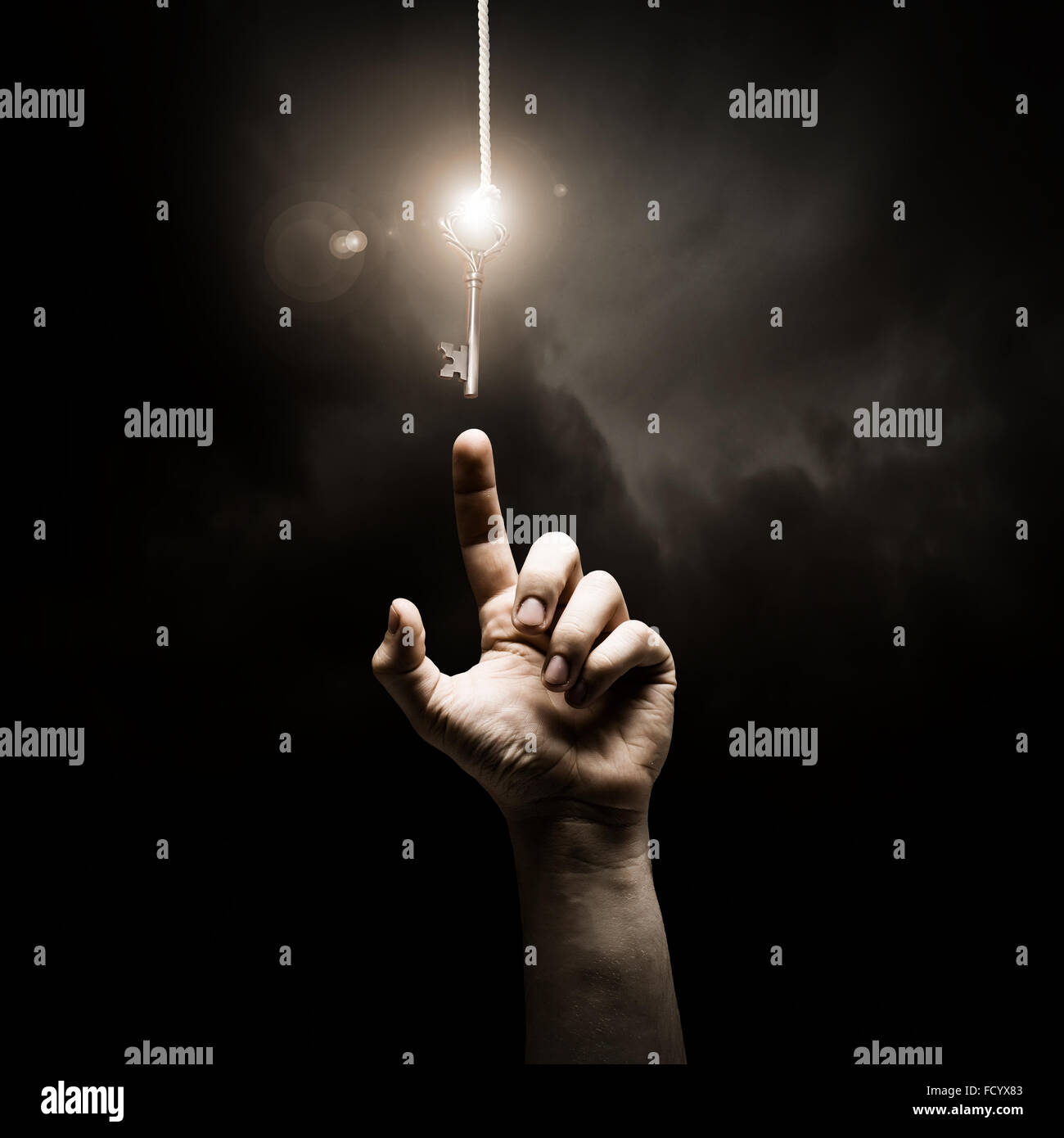 Close up of human hand holding key Stock Photo - Alamy