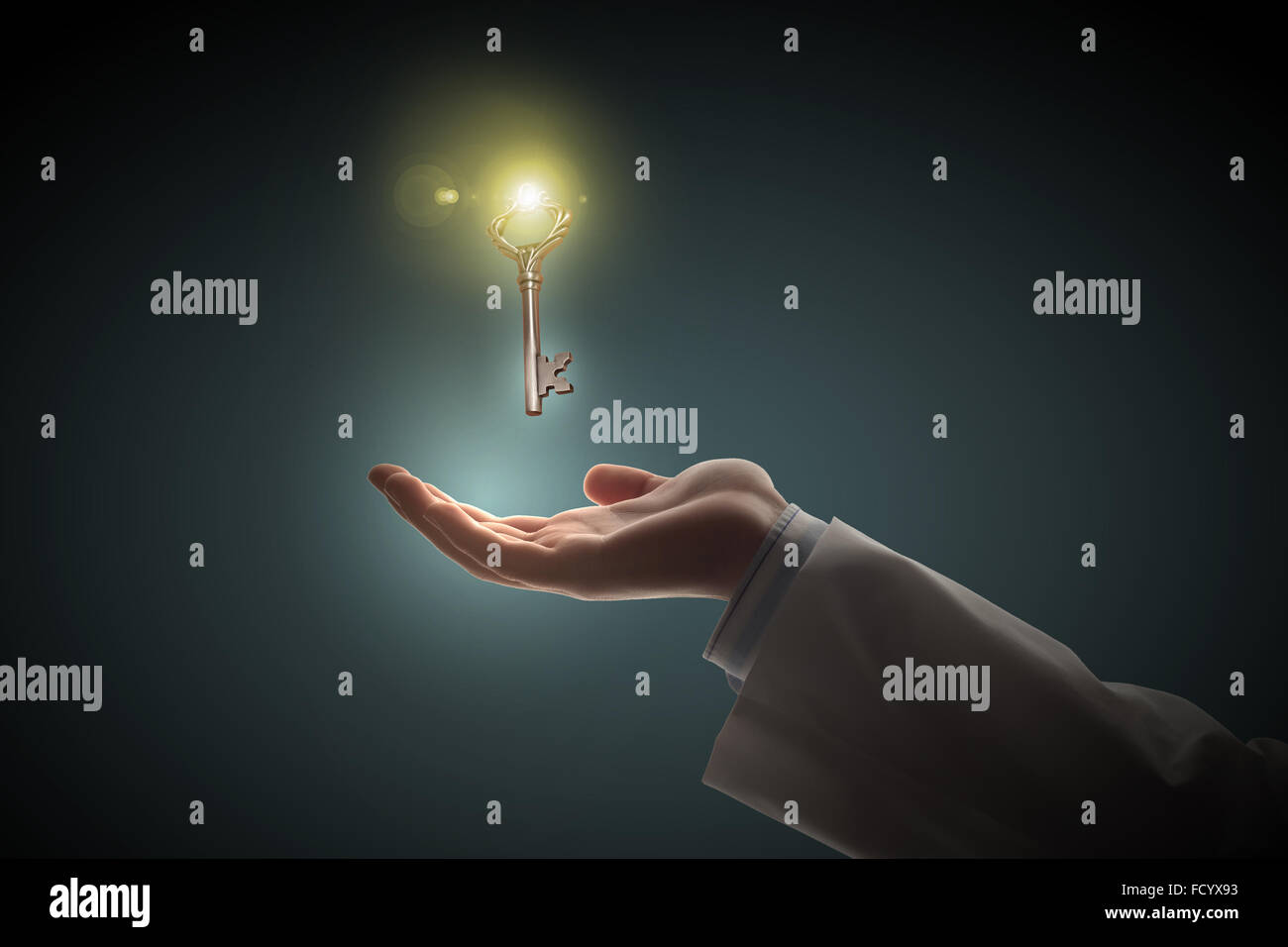 Close up of human hand holding key Stock Photo - Alamy
