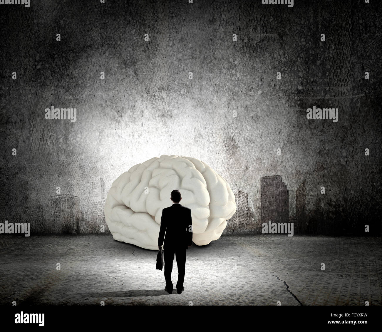 Rear view of businessman looking at big brain model Stock Photo - Alamy