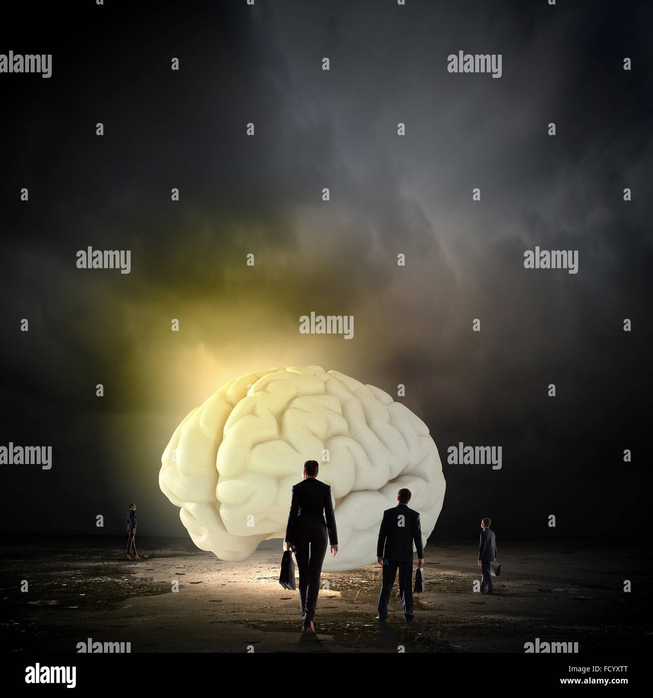 Huge human brain and many little businesspeople around Stock Photo - Alamy