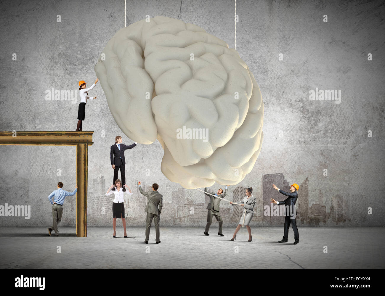 Huge human brain and many little businesspeople around Stock Photo - Alamy