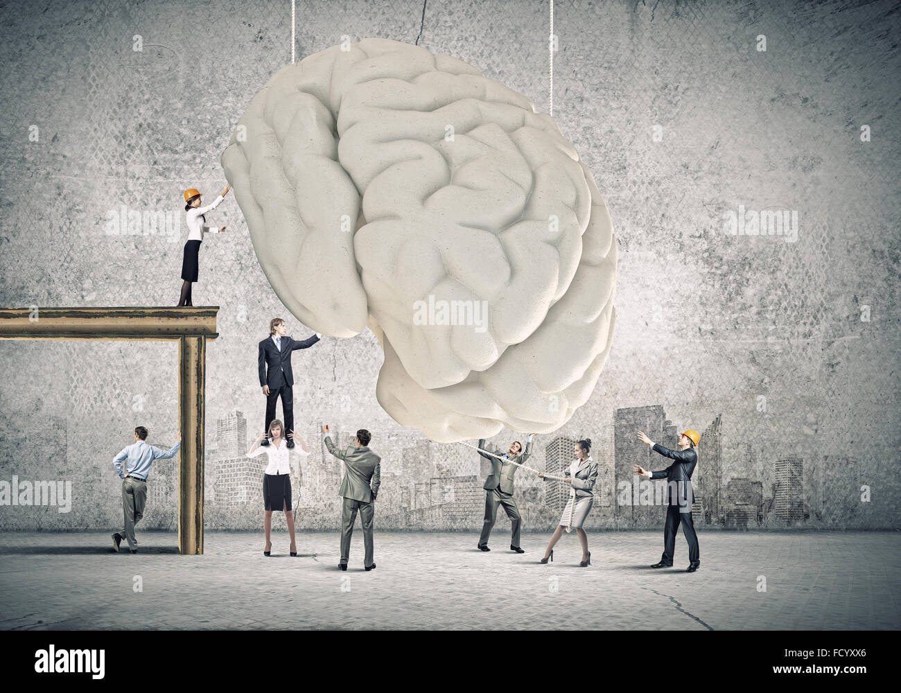 Huge human brain and many little businesspeople around Stock Photo - Alamy
