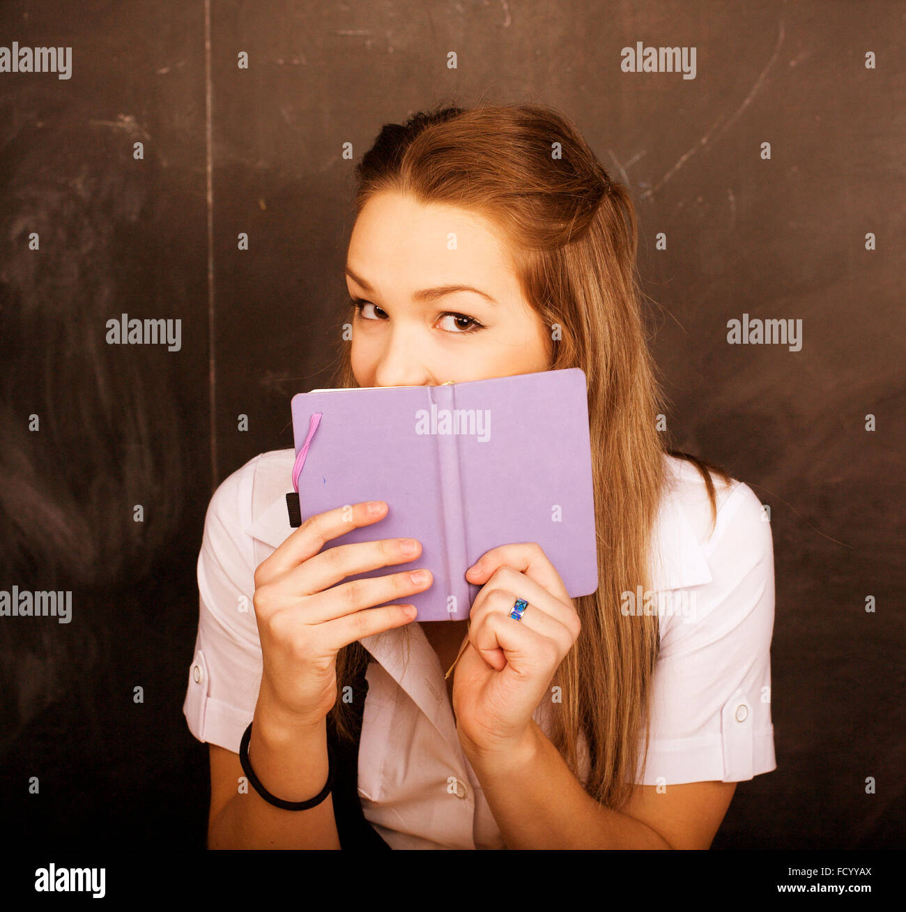 young pretty girl student in classroom at blackboard Stock Photo - Alamy
