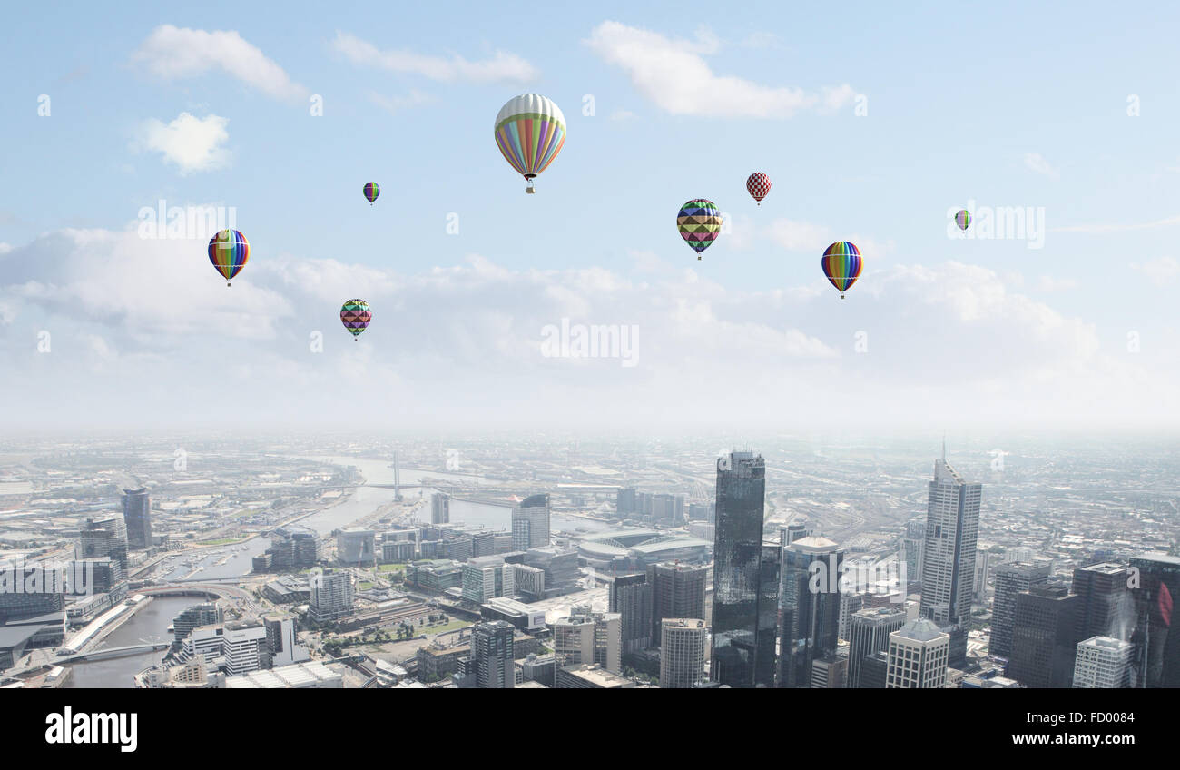 Conceptual image with colorful balloons flying high in sky Stock Photo ...
