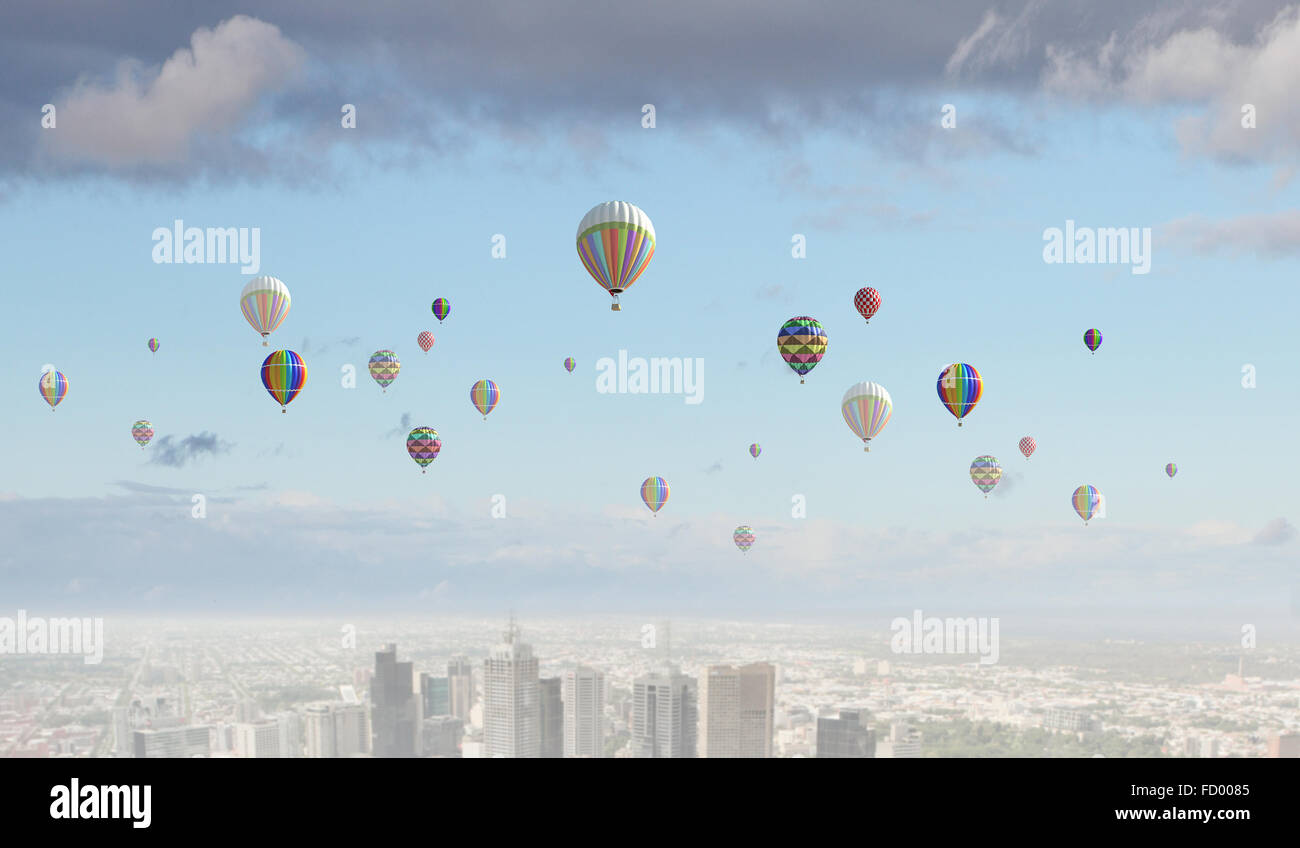 Conceptual image with colorful balloons flying high in sky Stock Photo ...