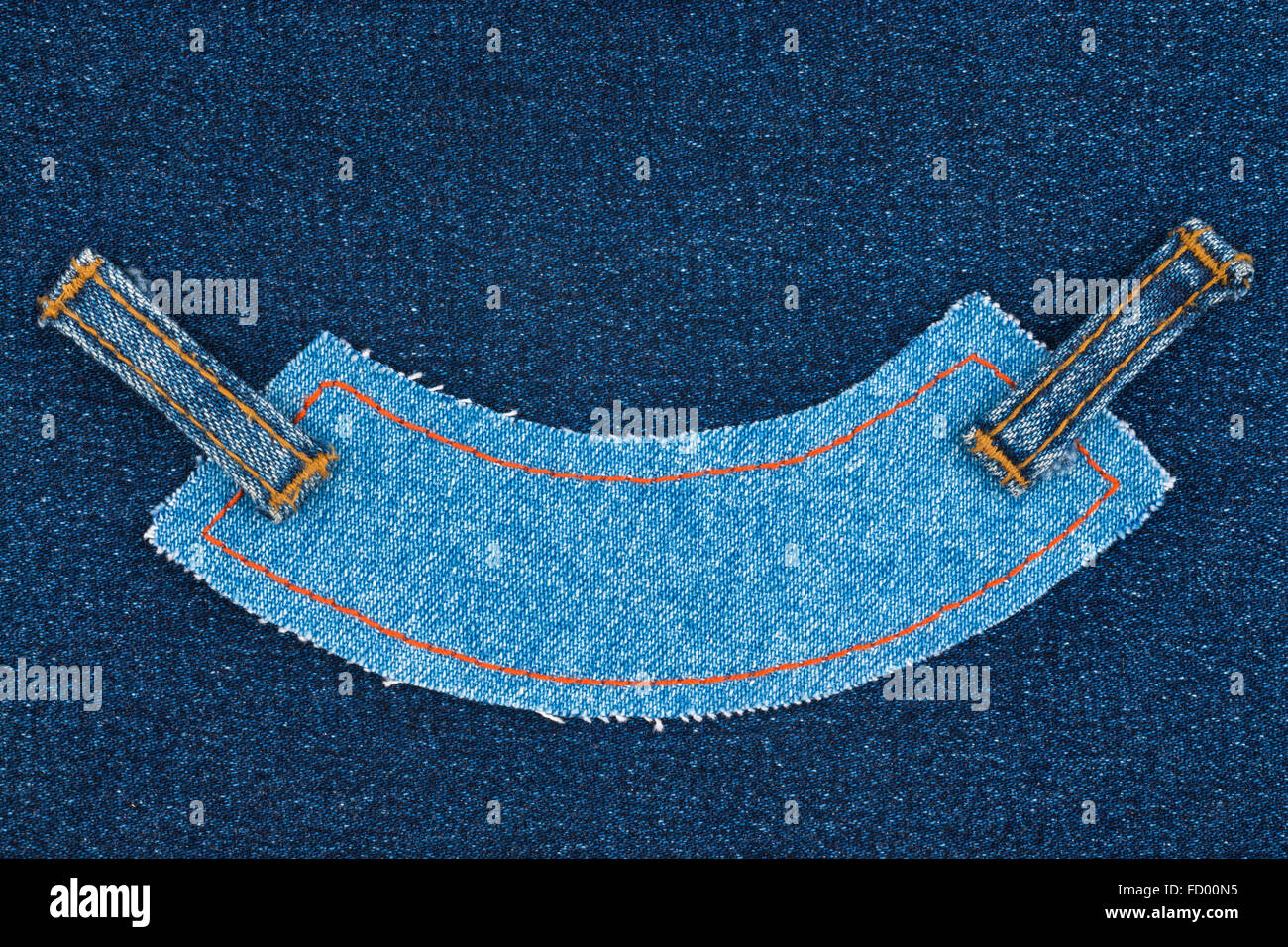 Blue denim jeans tag label lying on dark jeans.Texture, background ...