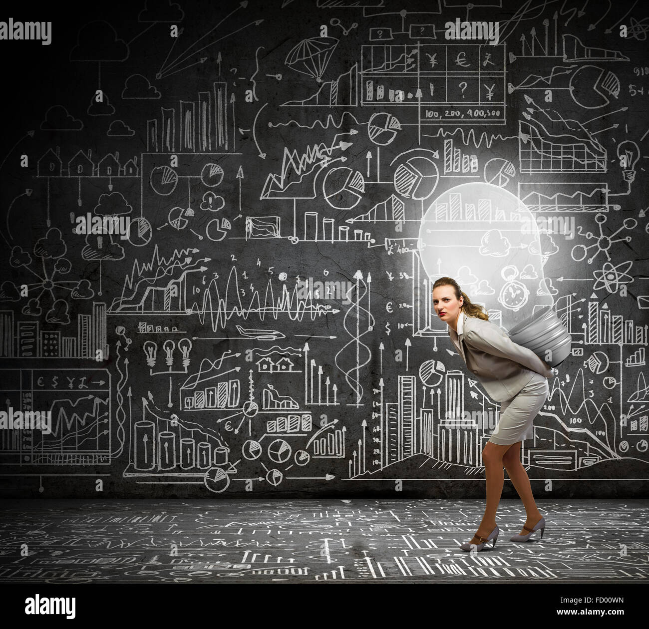 Young businesswoman carrying light bulb on back Stock Photo - Alamy
