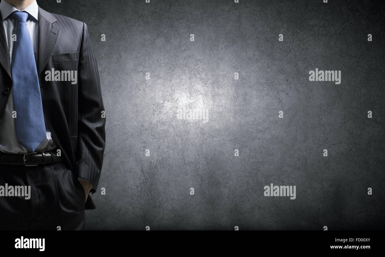 Close up of businessman with hands in pockets Stock Photo - Alamy