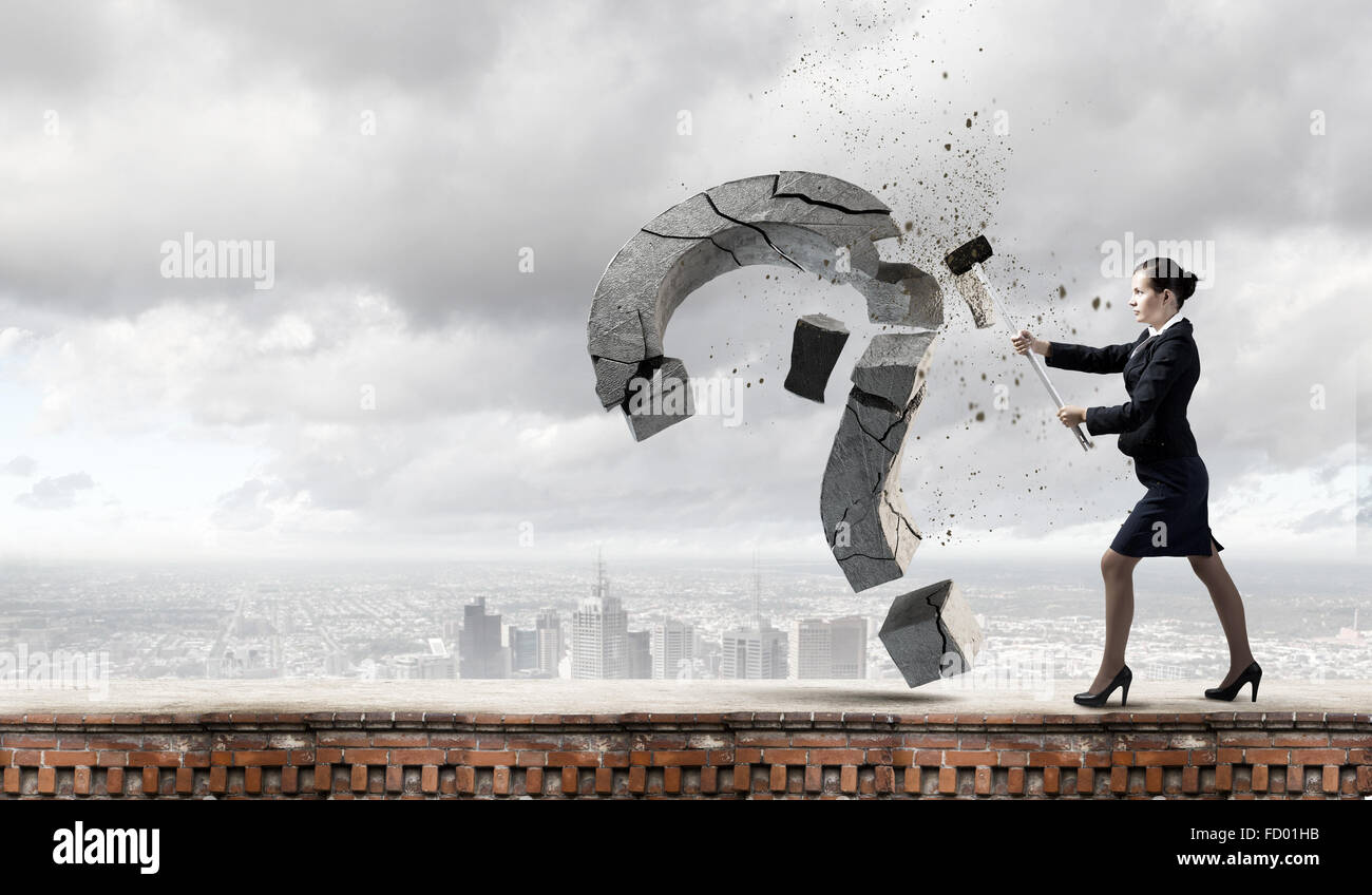 Young pretty businesswoman crashing stone question symbol Stock Photo ...
