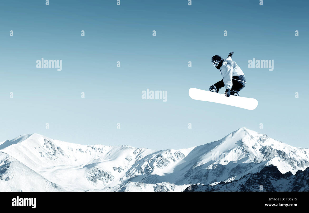 Snowboarder making jump high in clear sky Stock Photo - Alamy